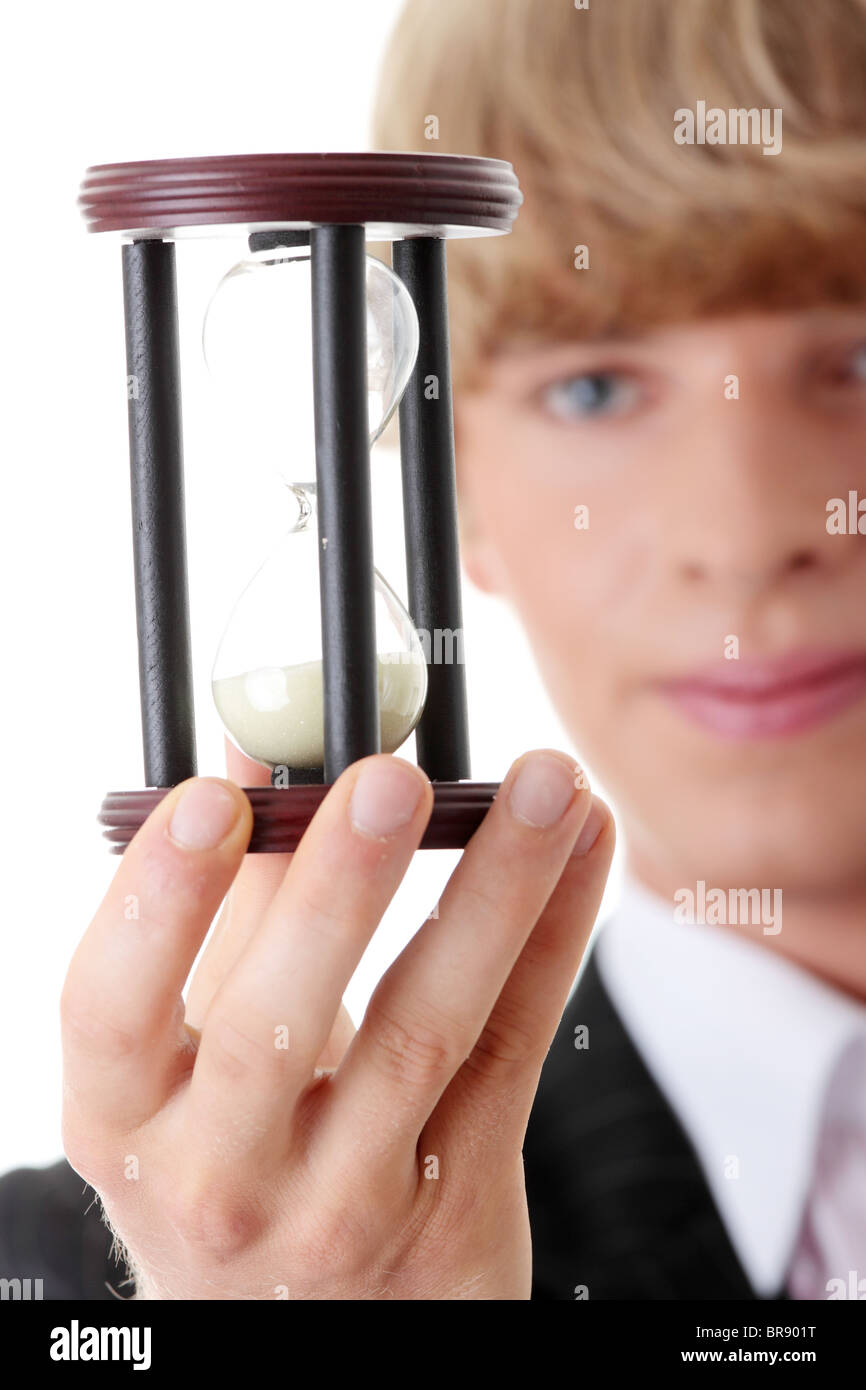 Businessman showing how to save time Stock Photo - Alamy