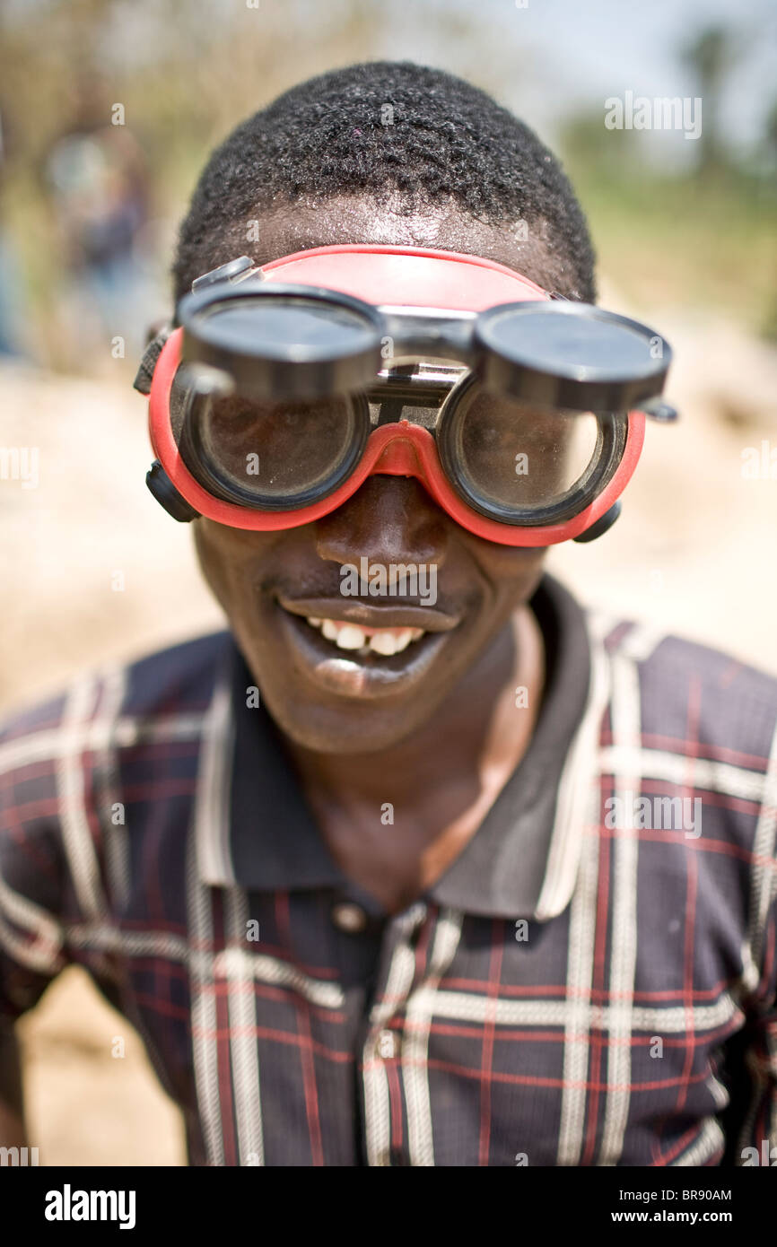 Portrait of a happy Liberian man wearing big googles Stock Photo - Alamy