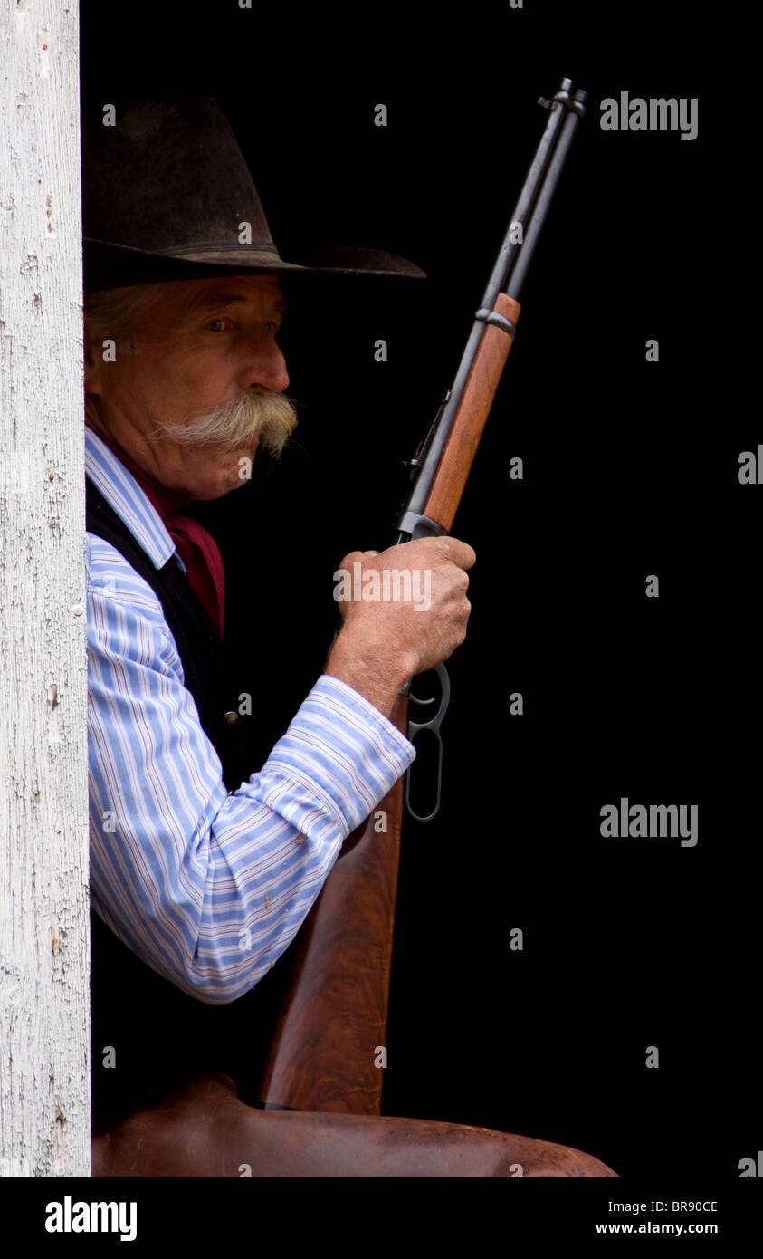 Cowboy with rifle hi-res stock photography and images - Alamy