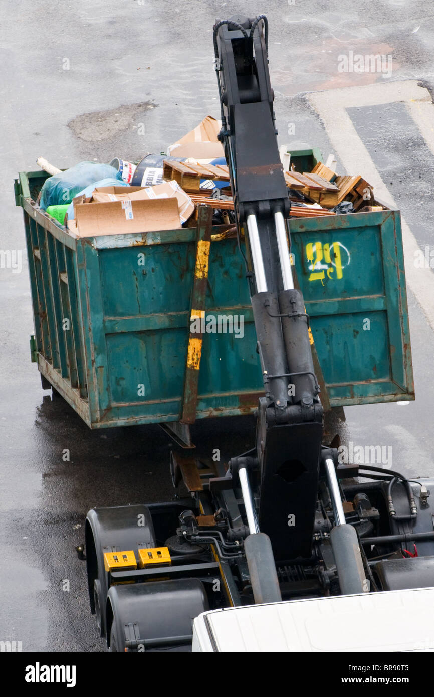 Rubbish clearance, the lifting and loading of a large skip full of ...