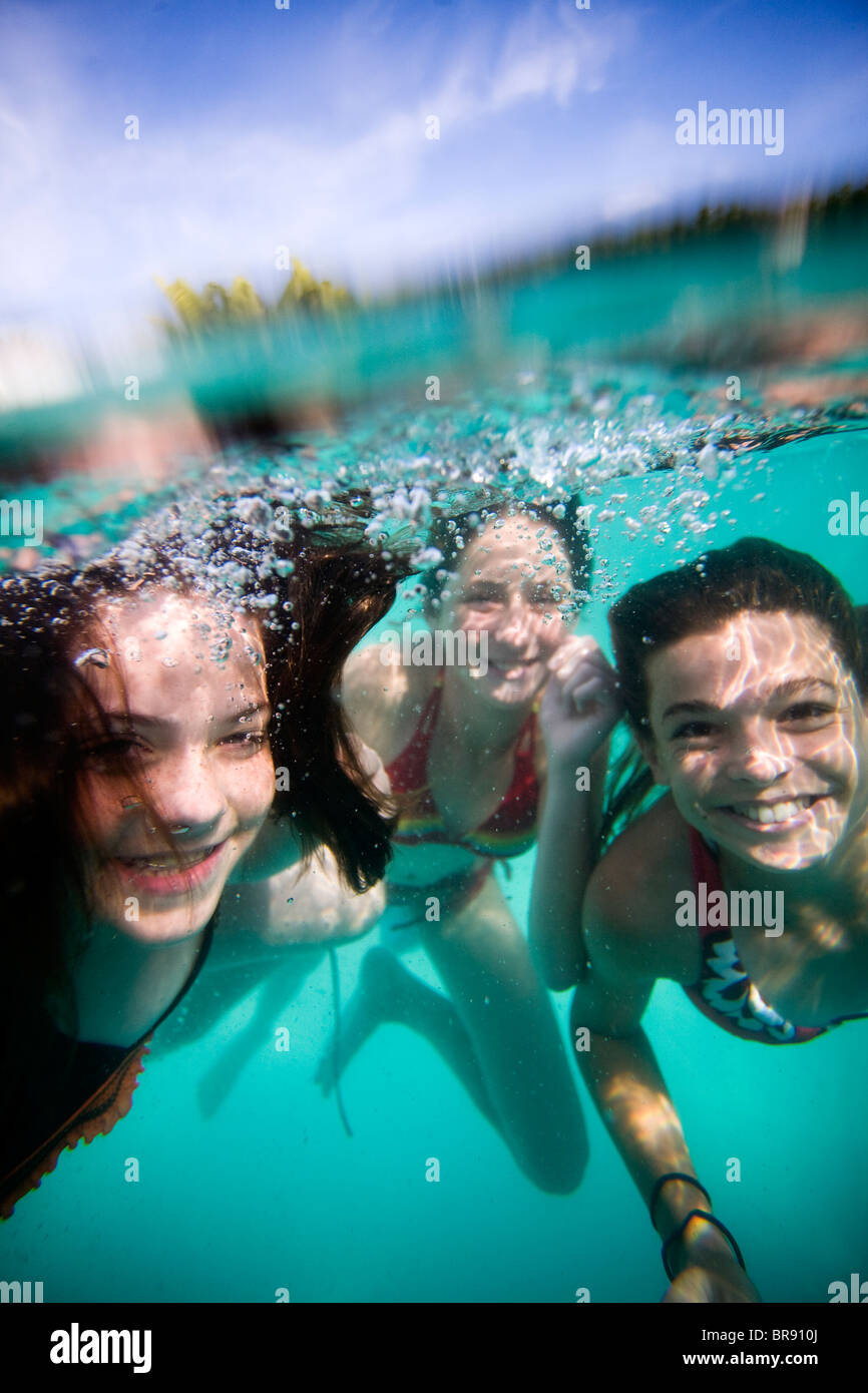 Girls swim underwater at a pool party Stock Photo, Royalty Free Image ...
