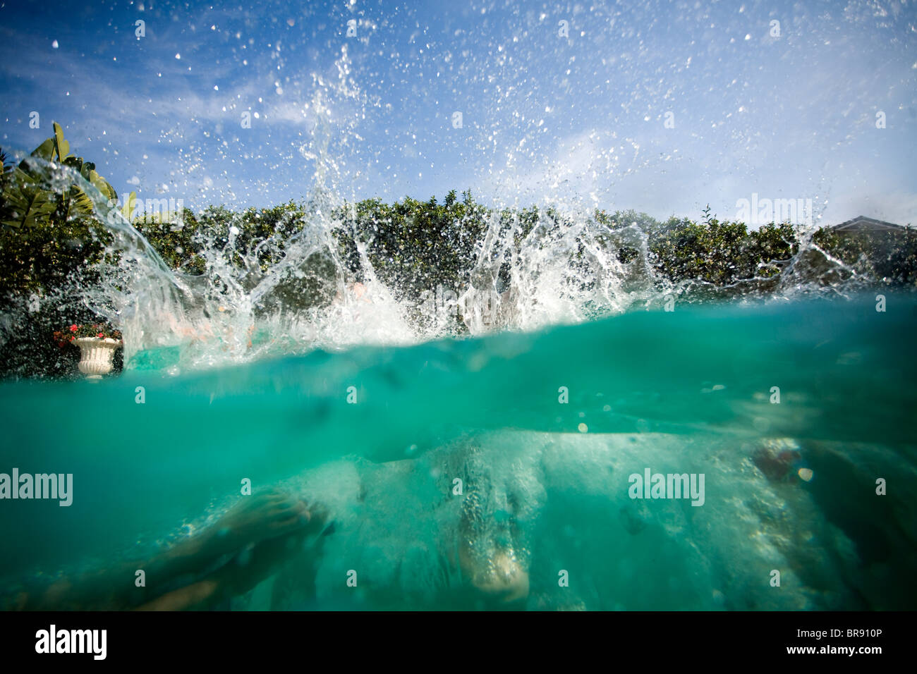 Girls splash into a pool at a pool party Stock Photo - Alamy