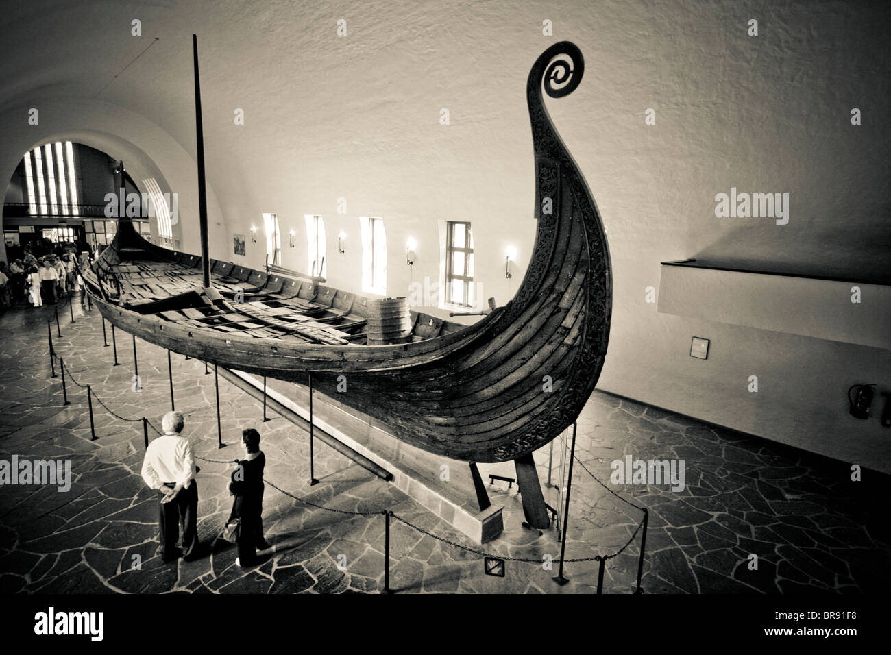 An old Viking ship is on display at the Viking Ship Museum or ...