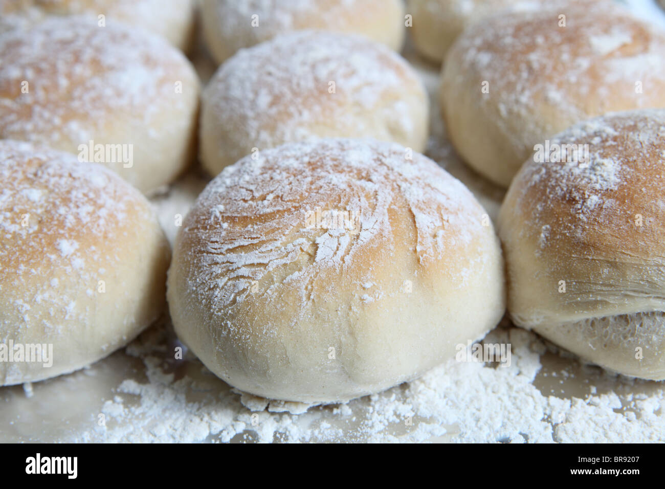 A tray of freshly baked Scottish morning rolls or baps, close-up Stock ...