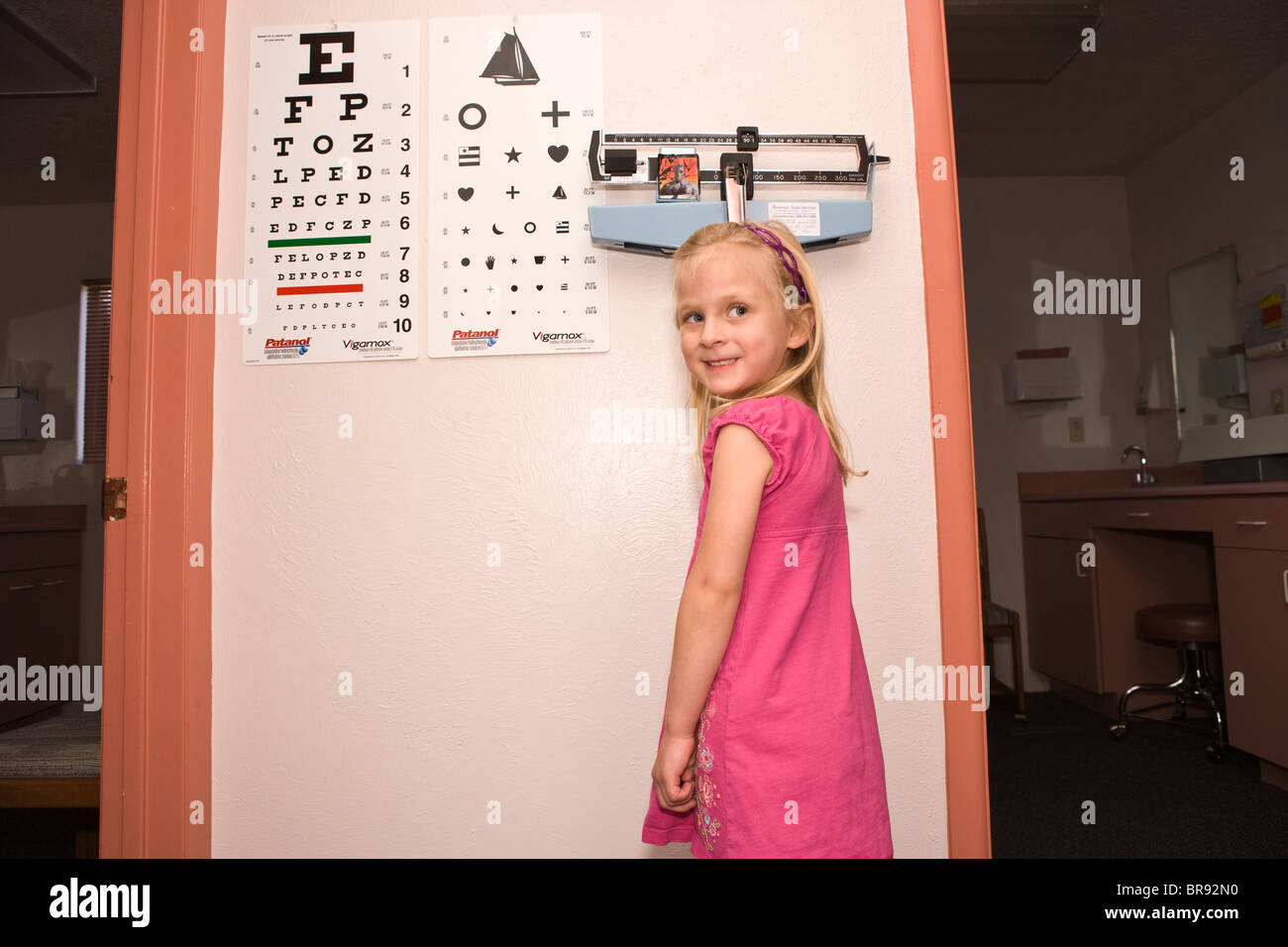 Child being weighed hi-res stock photography and images - Alamy