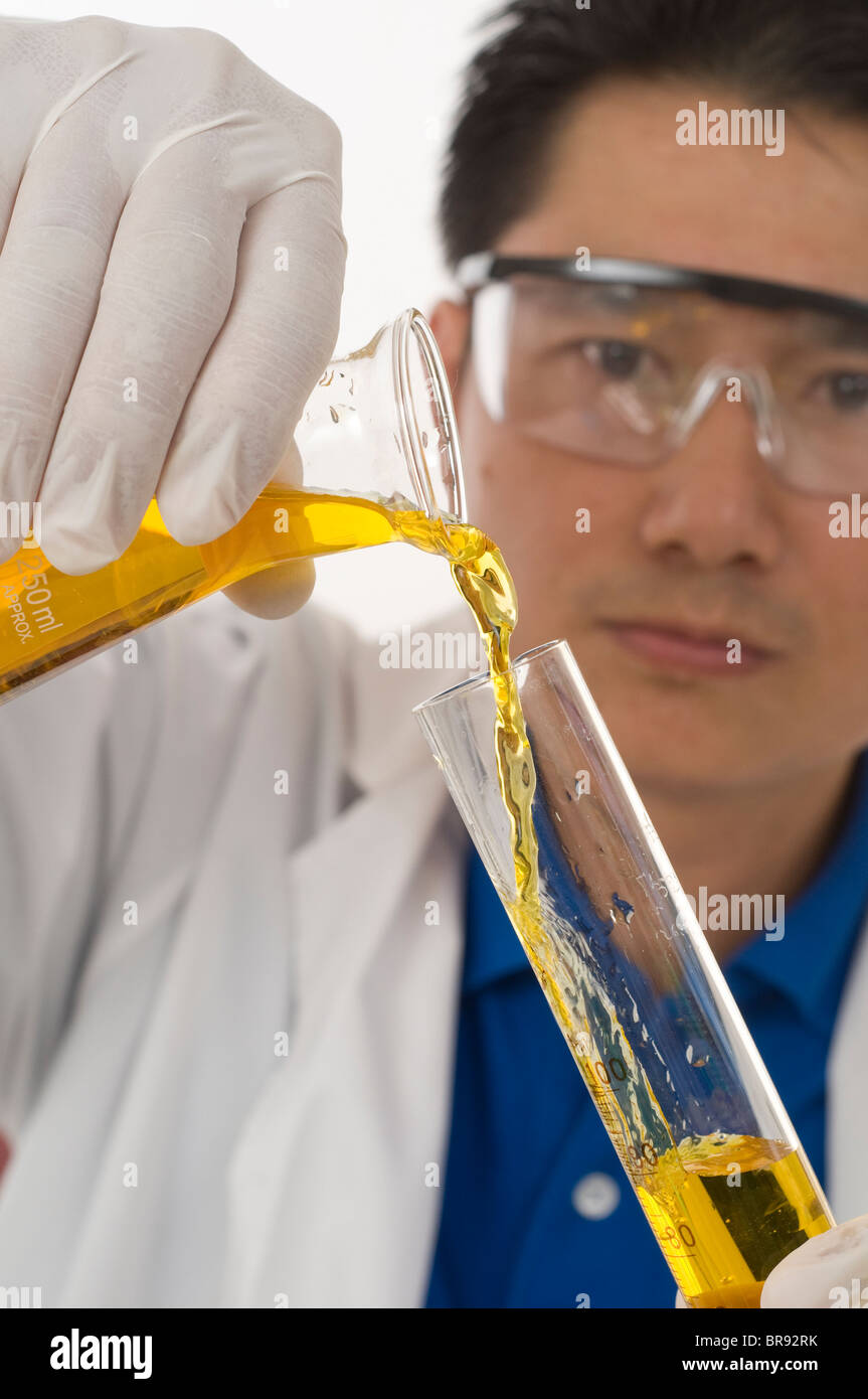 Scientist pouring chemicals in laboratory hi-res stock photography and ...