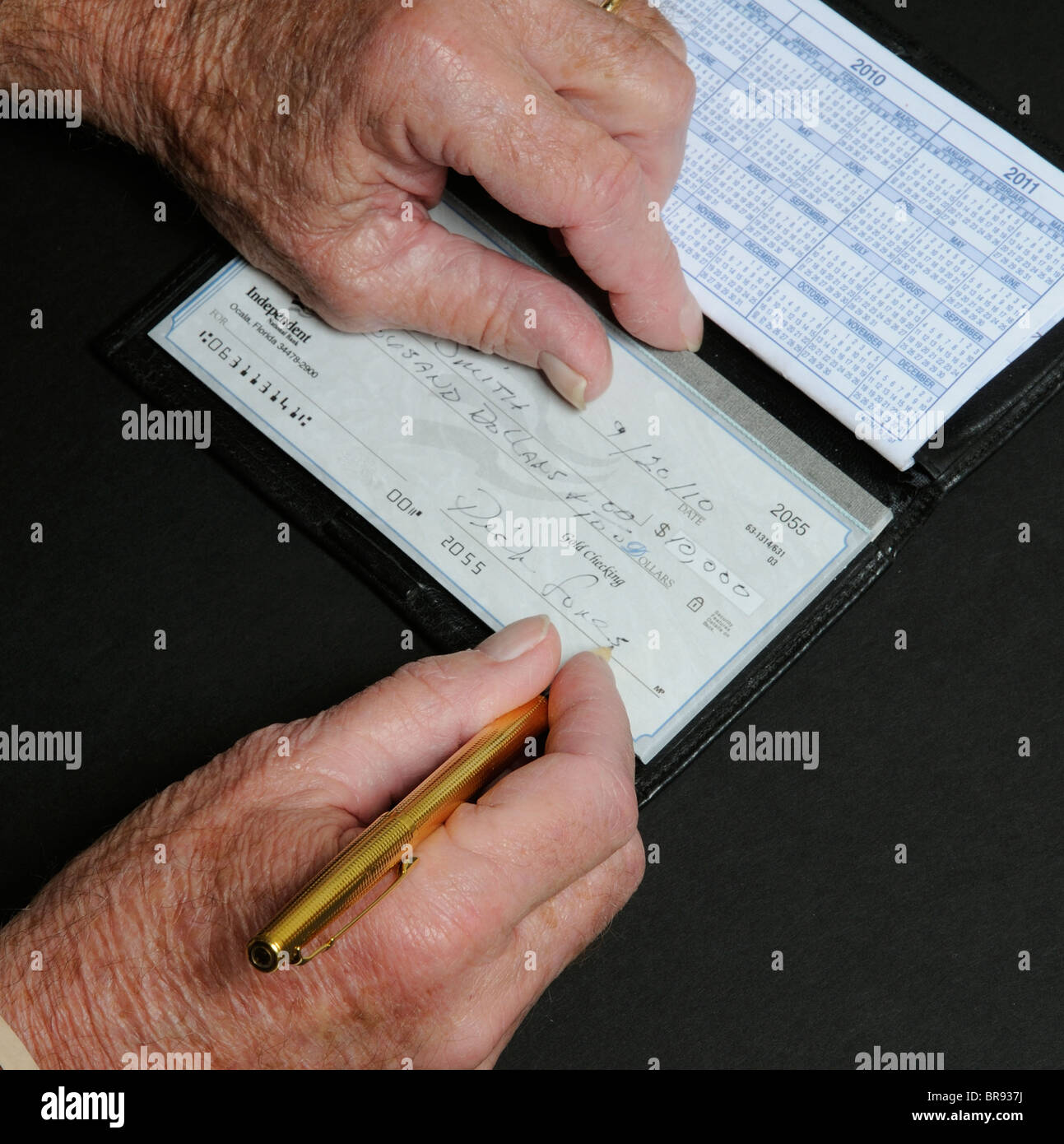Signing cheques High Resolution Stock Photography and Images - Alamy