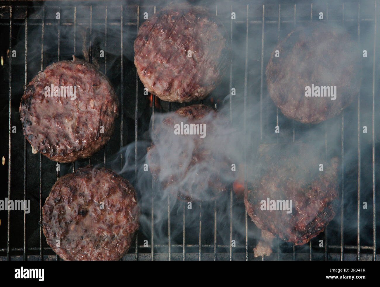 beef burgers cooking on a BBQ Stock Photo - Alamy