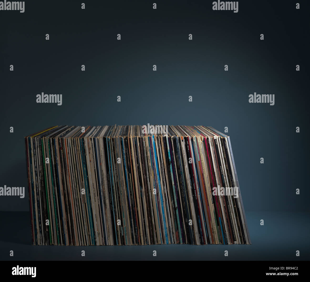 A studio Shot of a stack of records in a gray set Stock Photo - Alamy