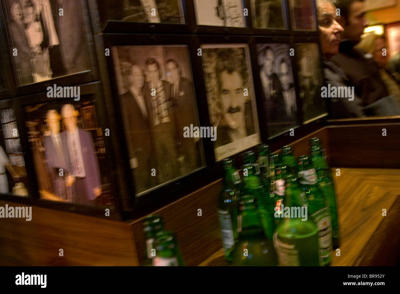 Beer bottles line up on a bar counter Stock Photo - Alamy