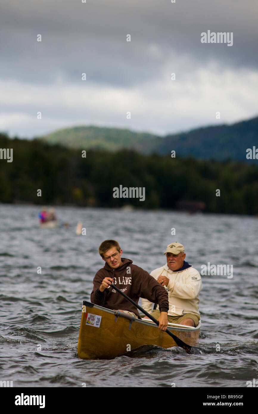 Father and son paddlers cross Fulton Chain of Lakes at Inlet, New York ...