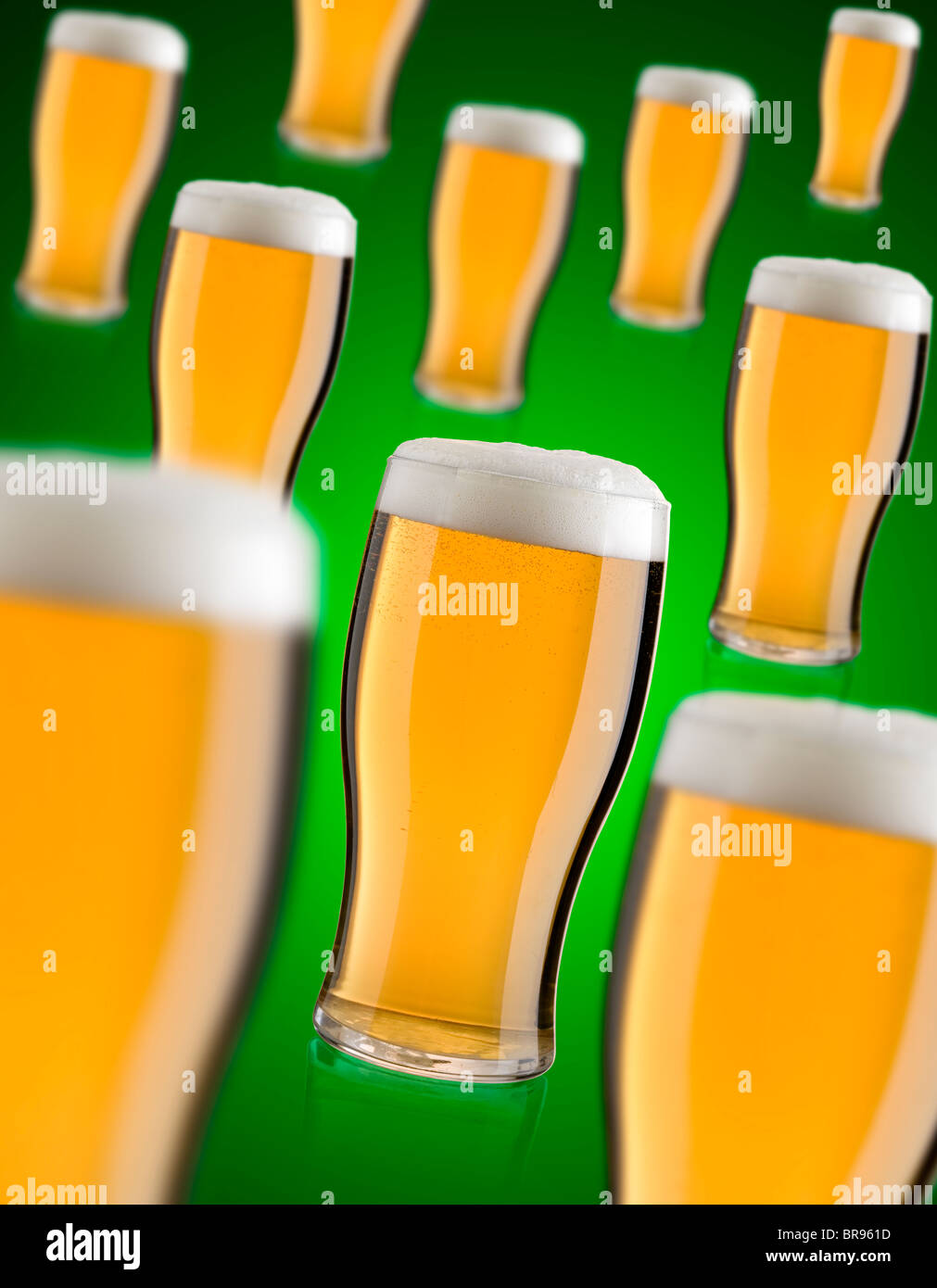 collection of lager on a green graduated background Stock Photo - Alamy