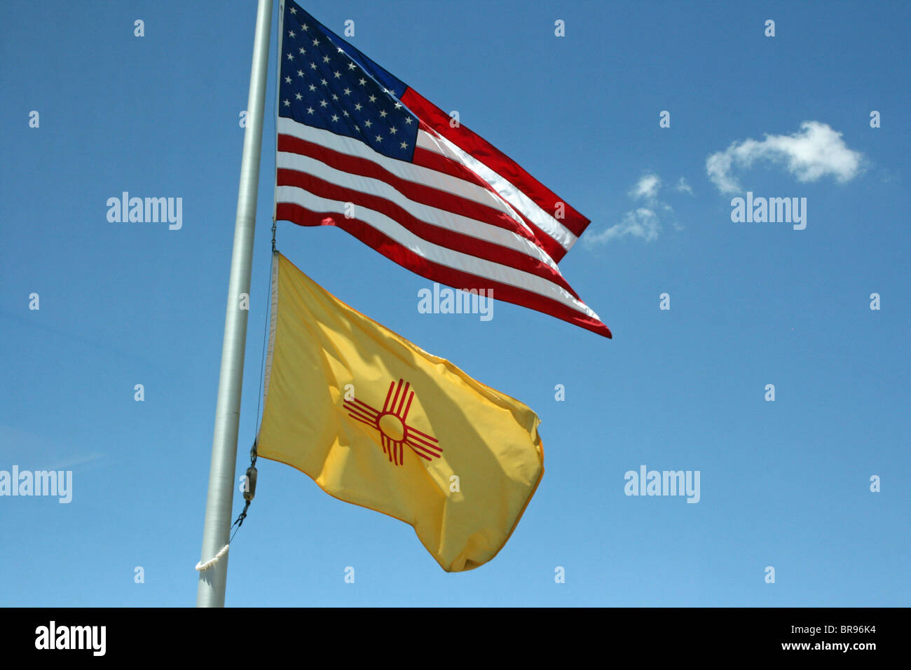 two flags flying: flag of United States of America, and flag of the ...