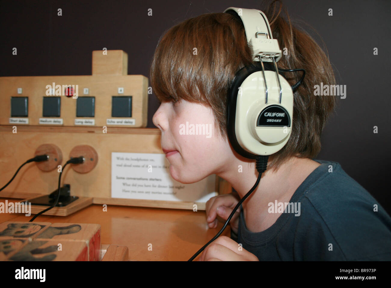 child forming speech sounds and imitating what he hears through the ...