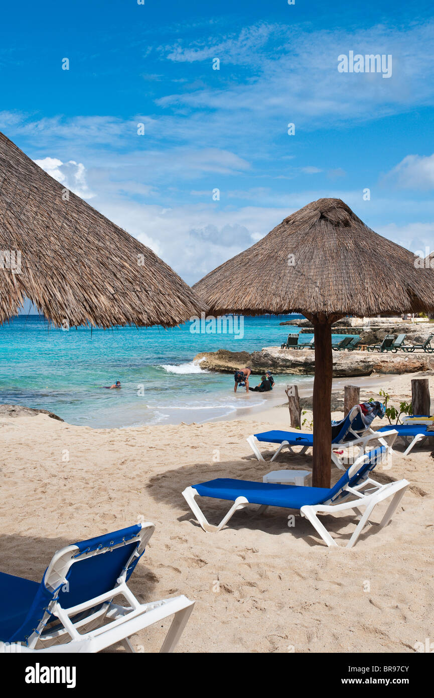 Mexico, Cozumel. Mexico, Cozumel. Beach umbrellas Playa Azul Hotel, San ...