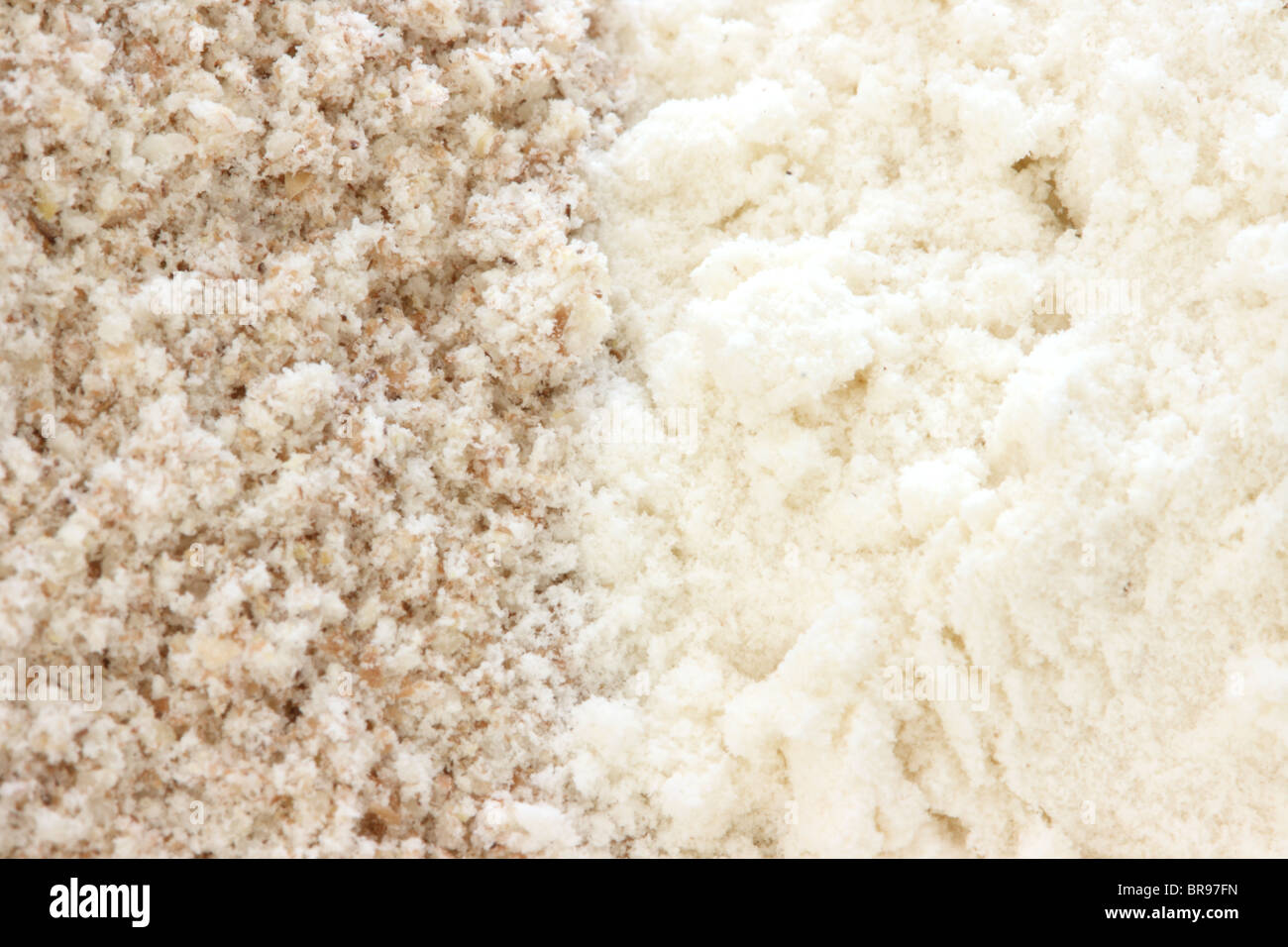 Close up view of two types of flour - whole grain / wholemeal and ...