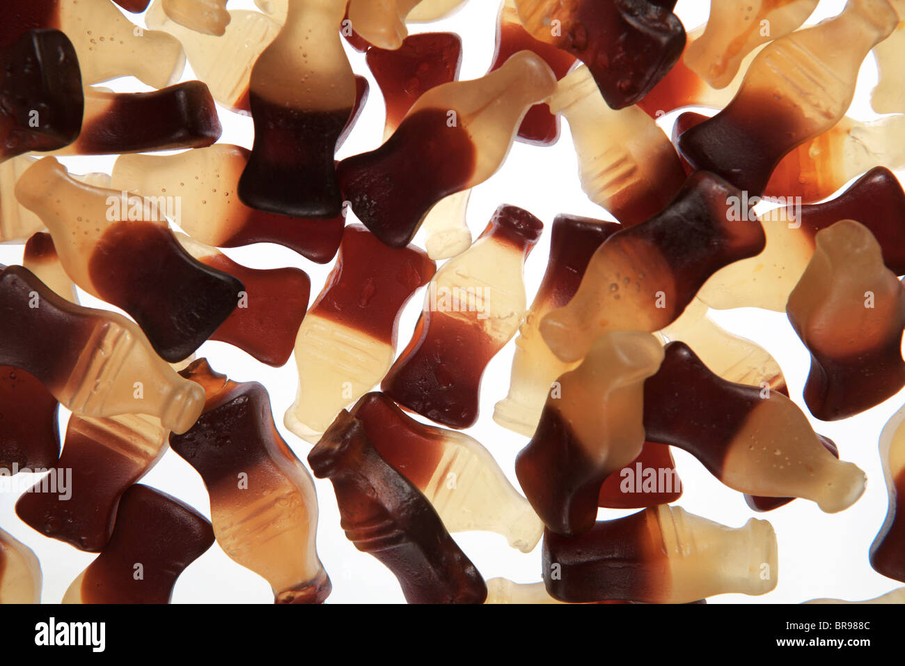cola bottle sweets on white back ground Stock Photo - Alamy