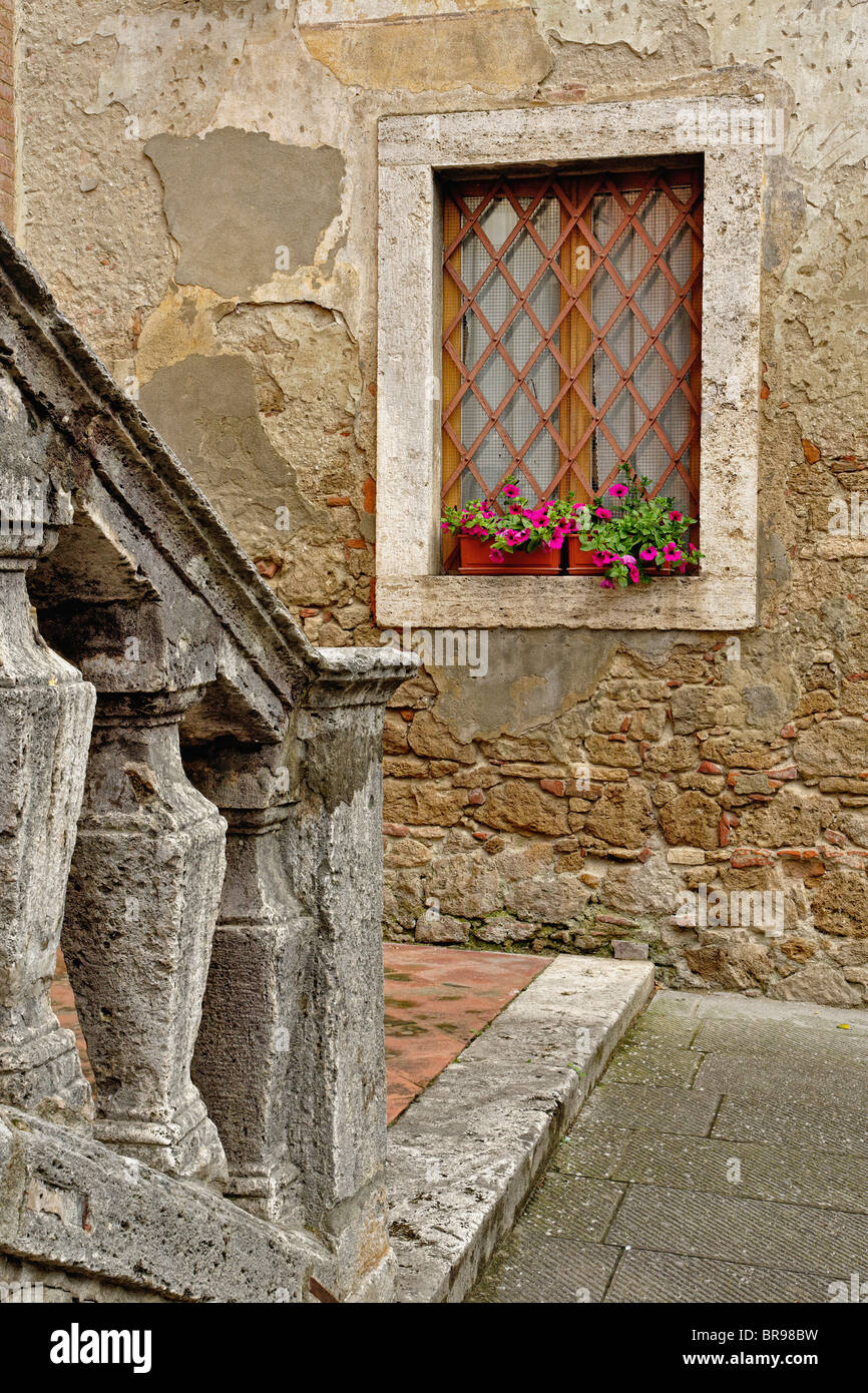 Medieval stone railing and window, Monteriggioni, in the Province of ...