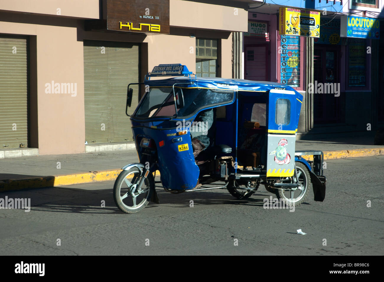 Converted motorcycle type of taxi, public transport, on the street at ...