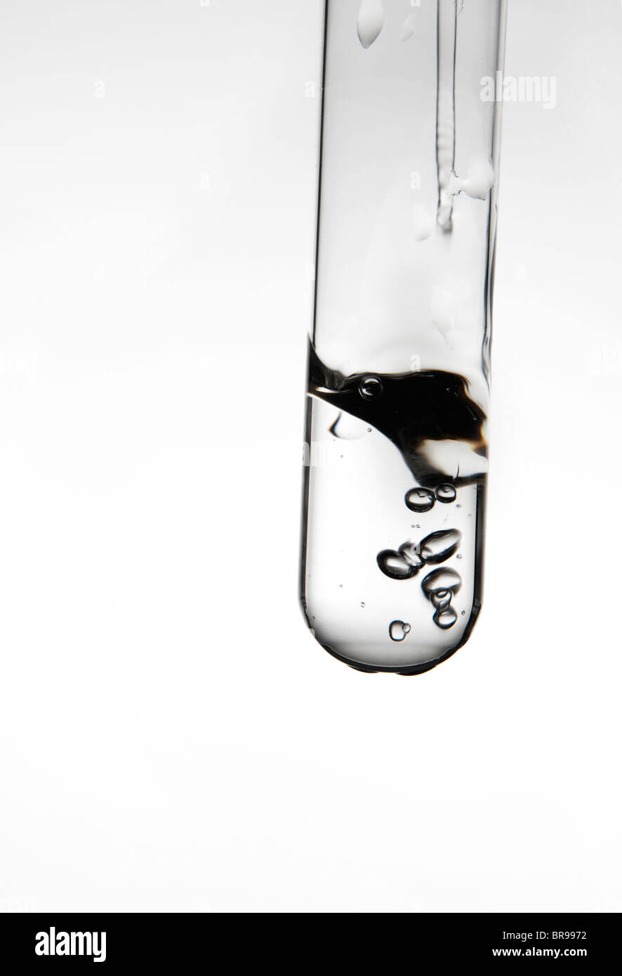 close up detail of single test tube on white background Stock Photo - Alamy