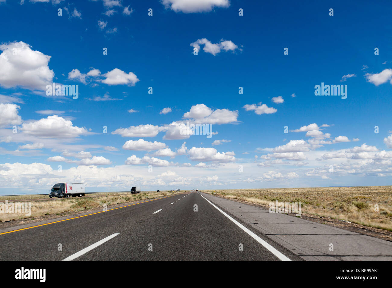 Highway road leading into distance in the high desert landscape of ...