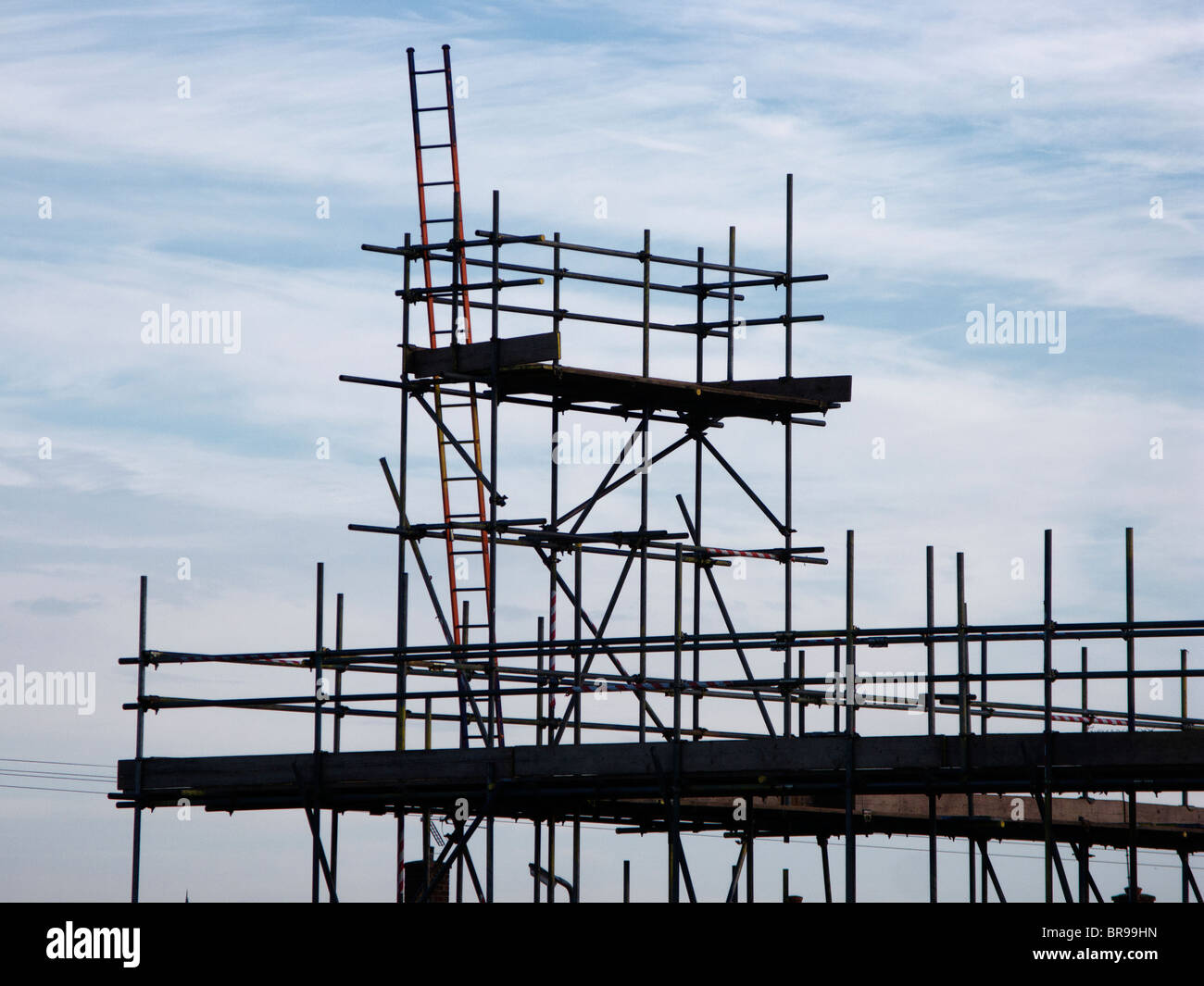 scaffolding againts a blue sky ready to build Stock Photo - Alamy