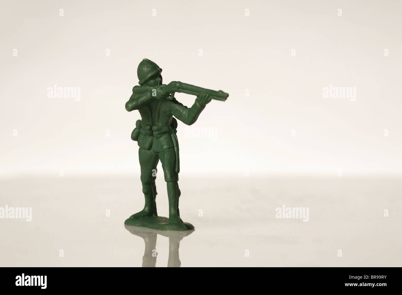 green toy soldiers on white back ground Stock Photo - Alamy