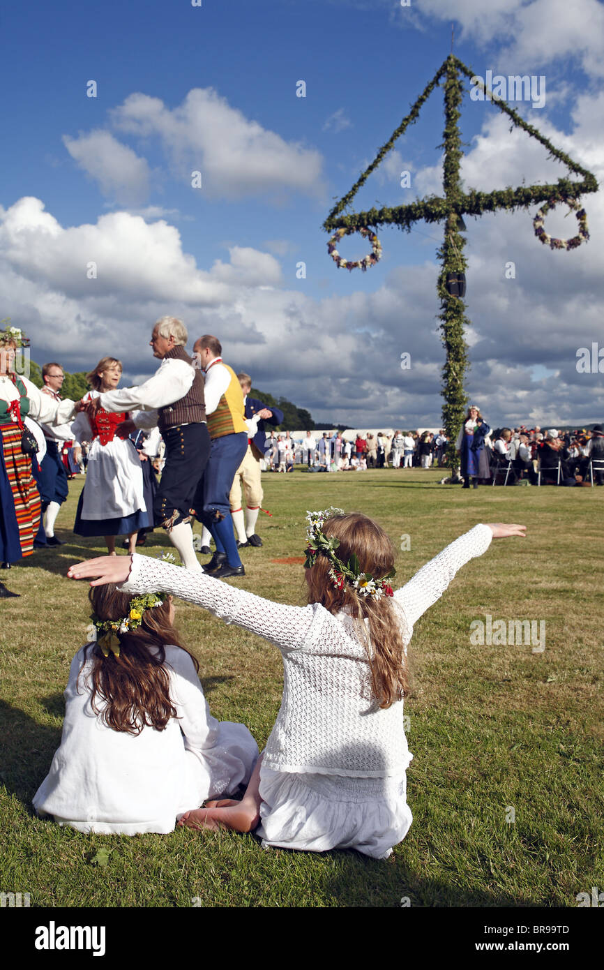 Dance around maypole traditional costume hi-res stock photography and ...
