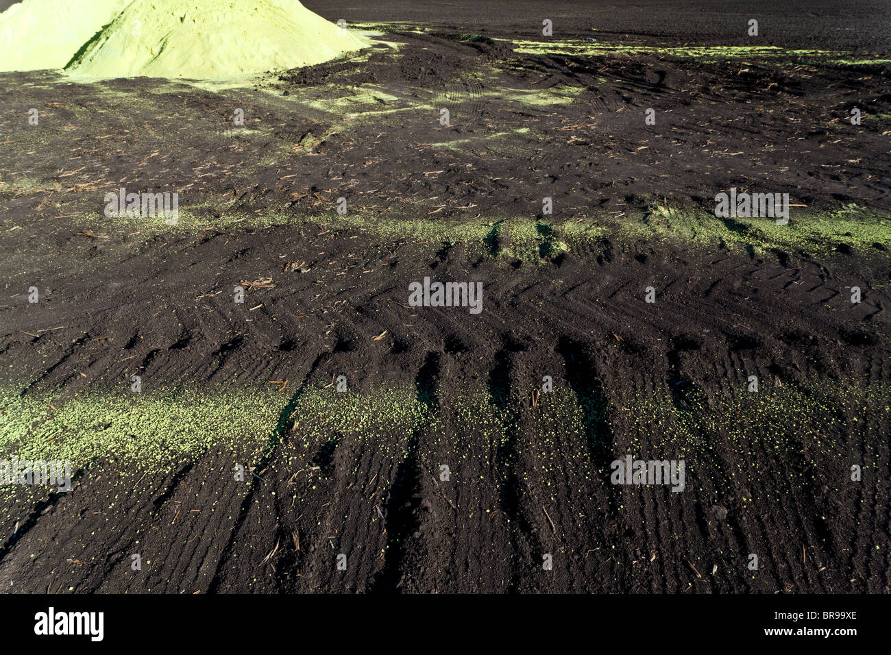 Sulfur piled and spread on a field near Turlock California Stock Photo ...