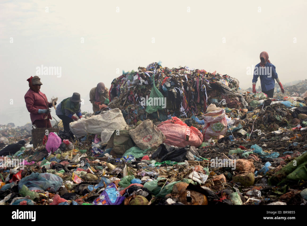 Workers at The Stung Meanchey Landfill in Phnom Penh, Cambodia, select ...