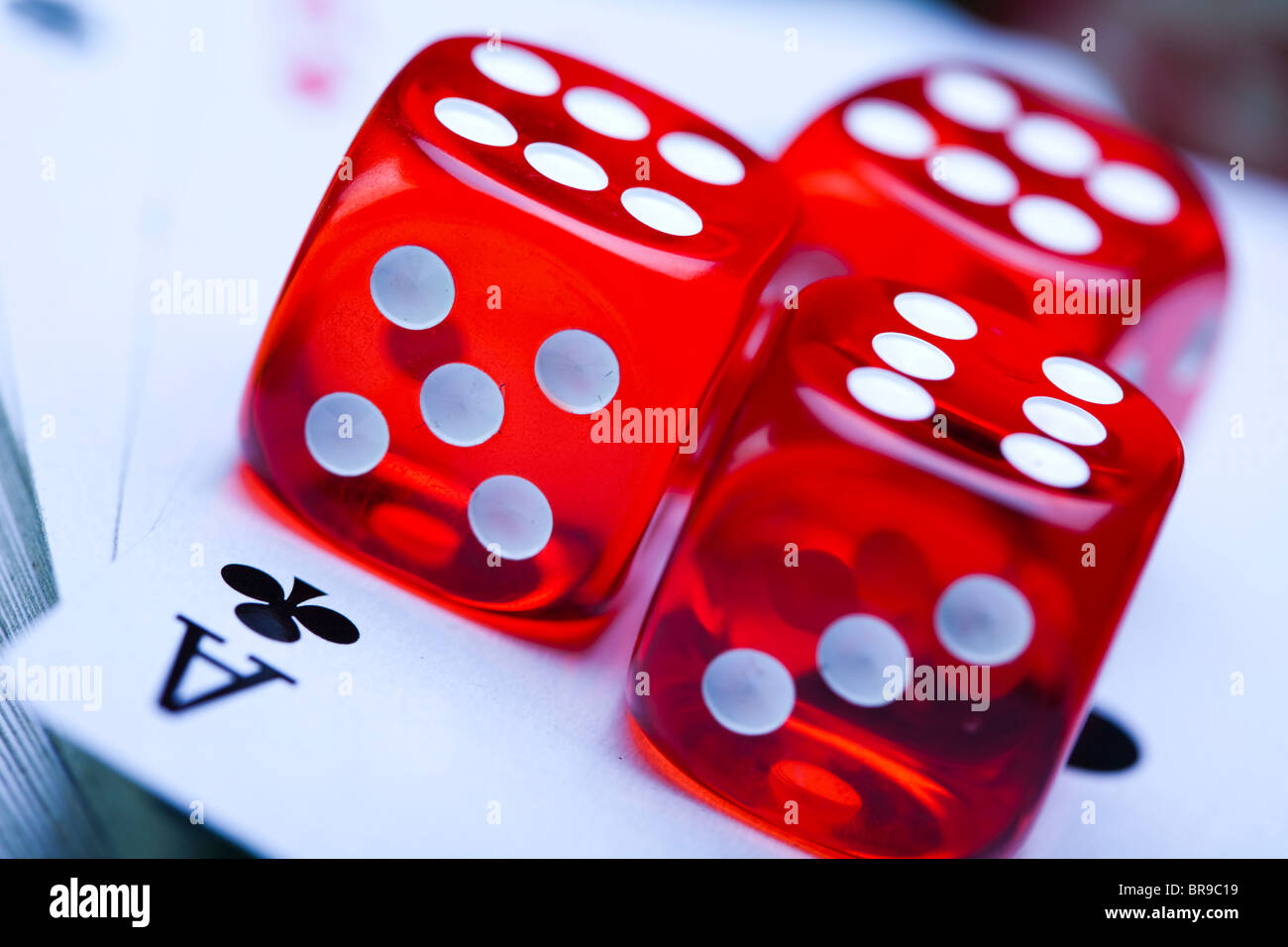 Dice on cards Stock Photo - Alamy