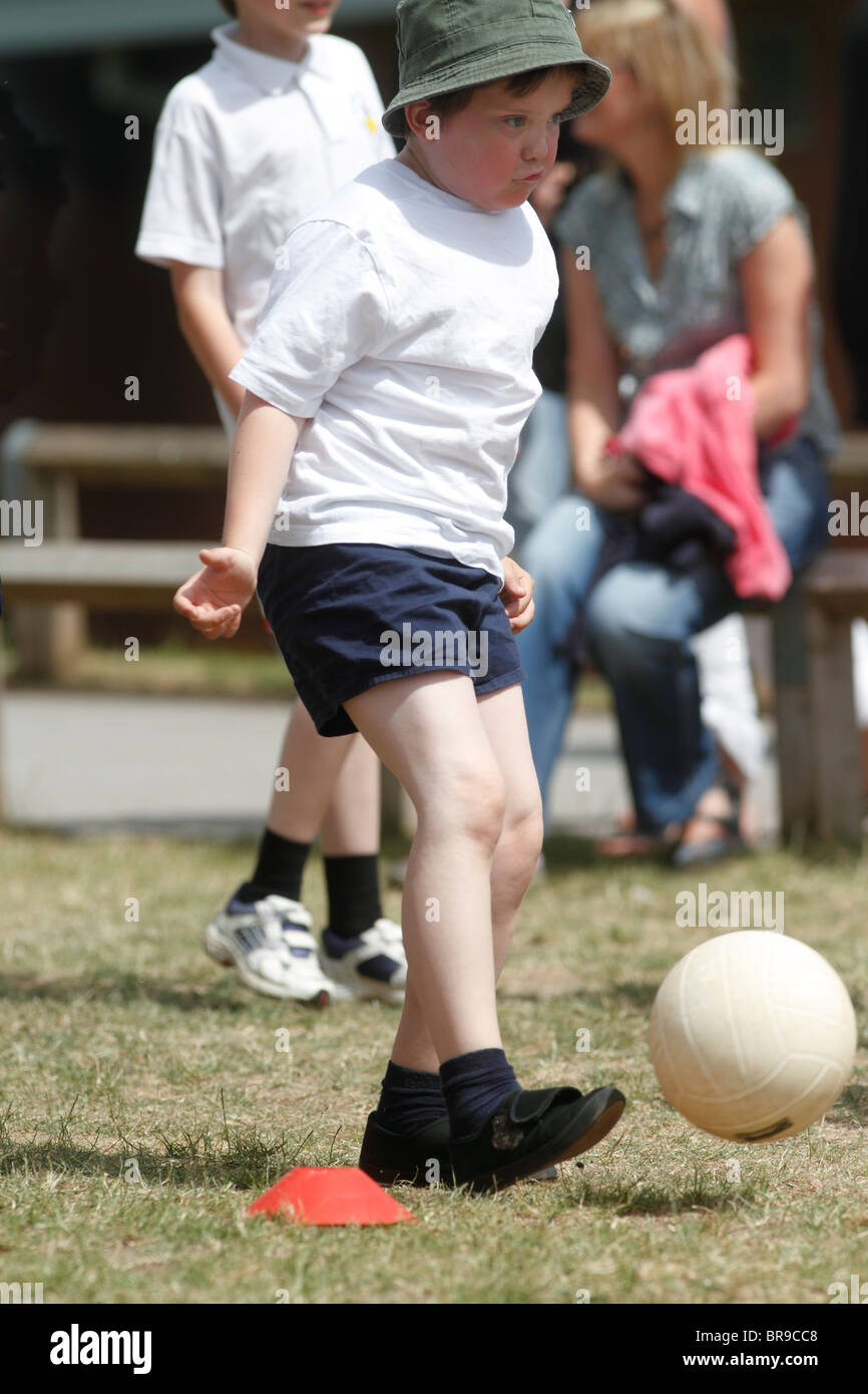 School Sport Day - Playing football Stock Photo - Alamy