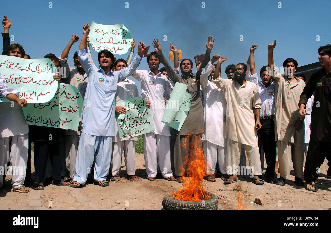 Activists of Muslim Students Federation-N stand near burning tyre shout ...