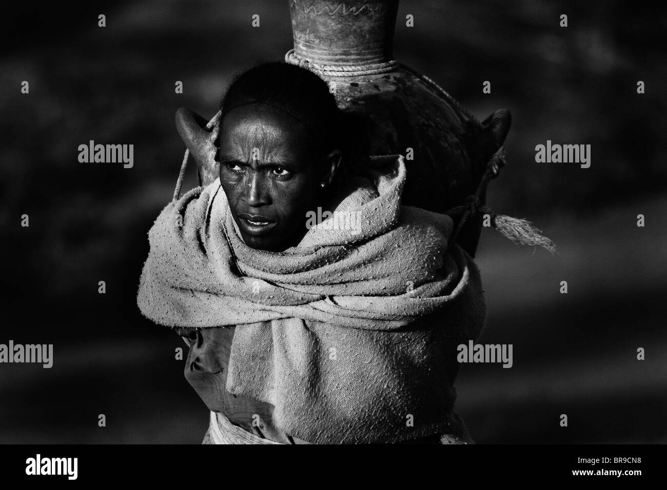 Woman taking a water vat to her house Sekota Ethiopia Stock Photo - Alamy