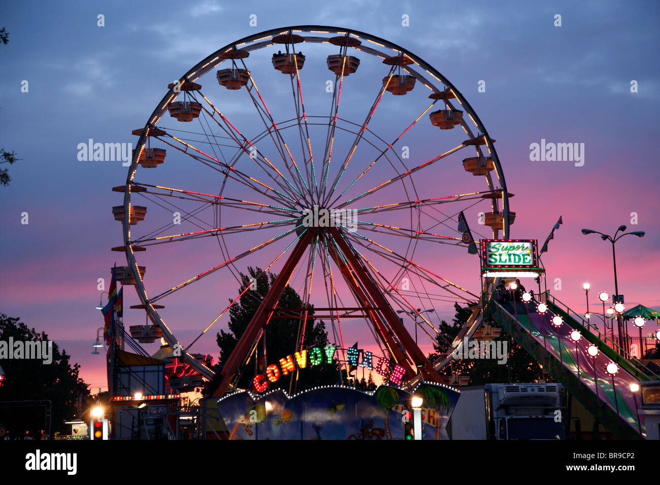 Ferris wheel at sunset Stock Photo - Alamy