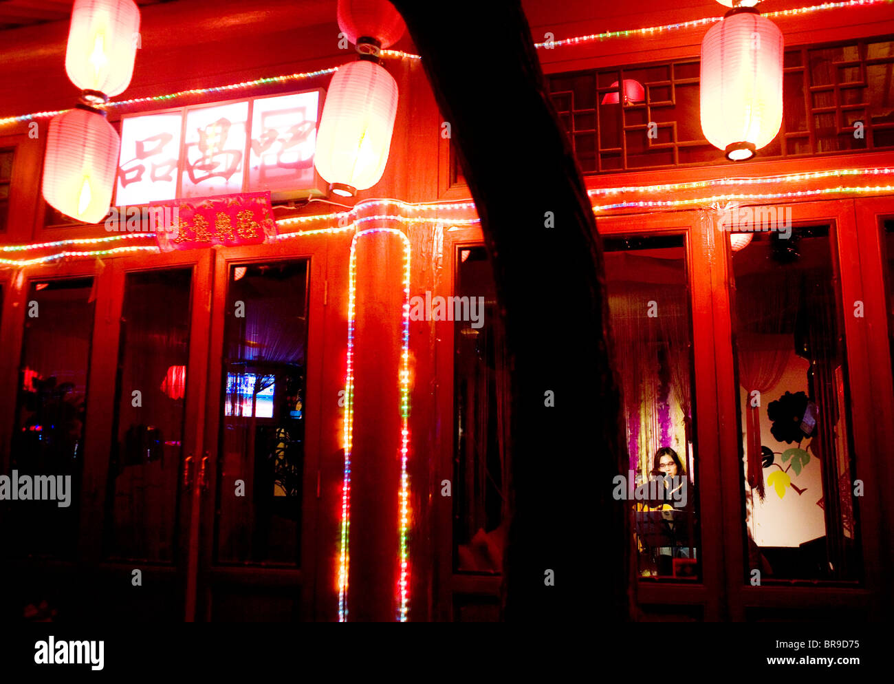 A man plays guitar in a bar in Beijing China Stock Photo - Alamy