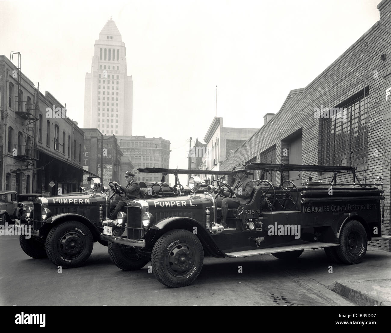 1920s 1930s TWO FIRE TRUCKS WITH LOS ANGELES CITY HALL IN BACKGROUND ...