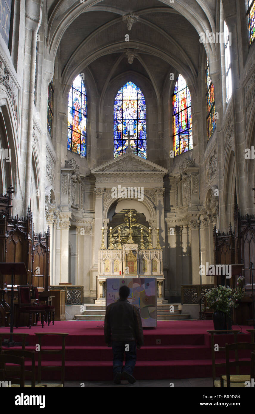 Paris - prayer in the gothic church Stock Photo - Alamy