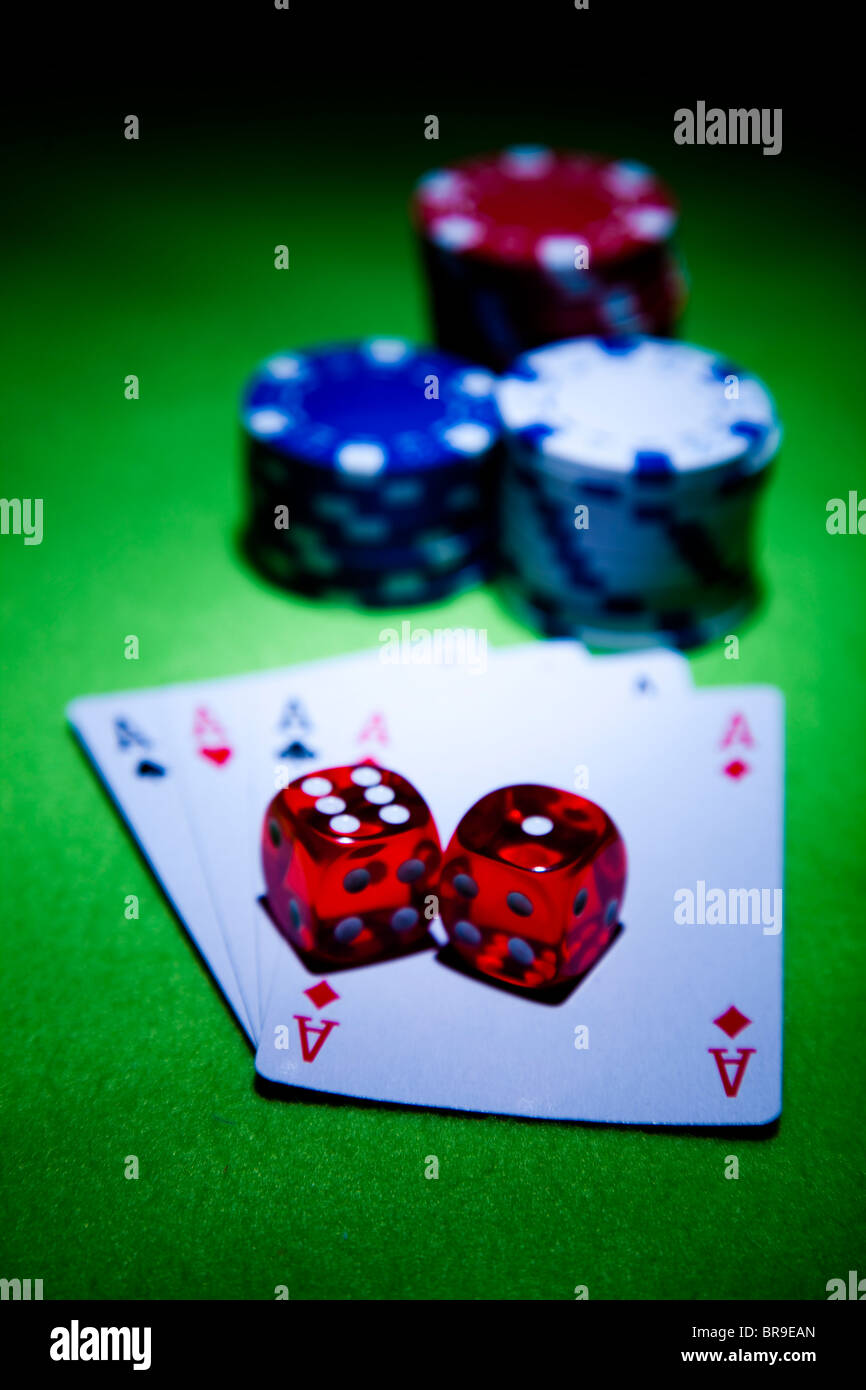 Dice on cards Stock Photo - Alamy