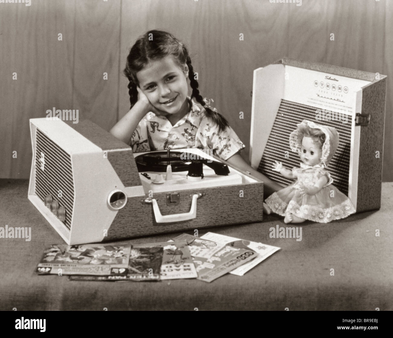 1950s SMILING GIRL LISTENING TO PORTABLE RECORD PLAYER Stock Photo - Alamy