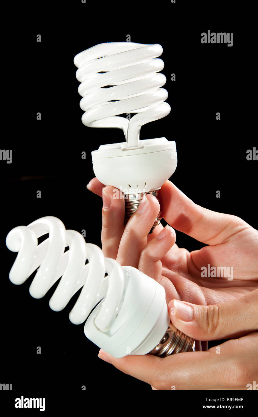 energy saving light bulb in hand Stock Photo - Alamy