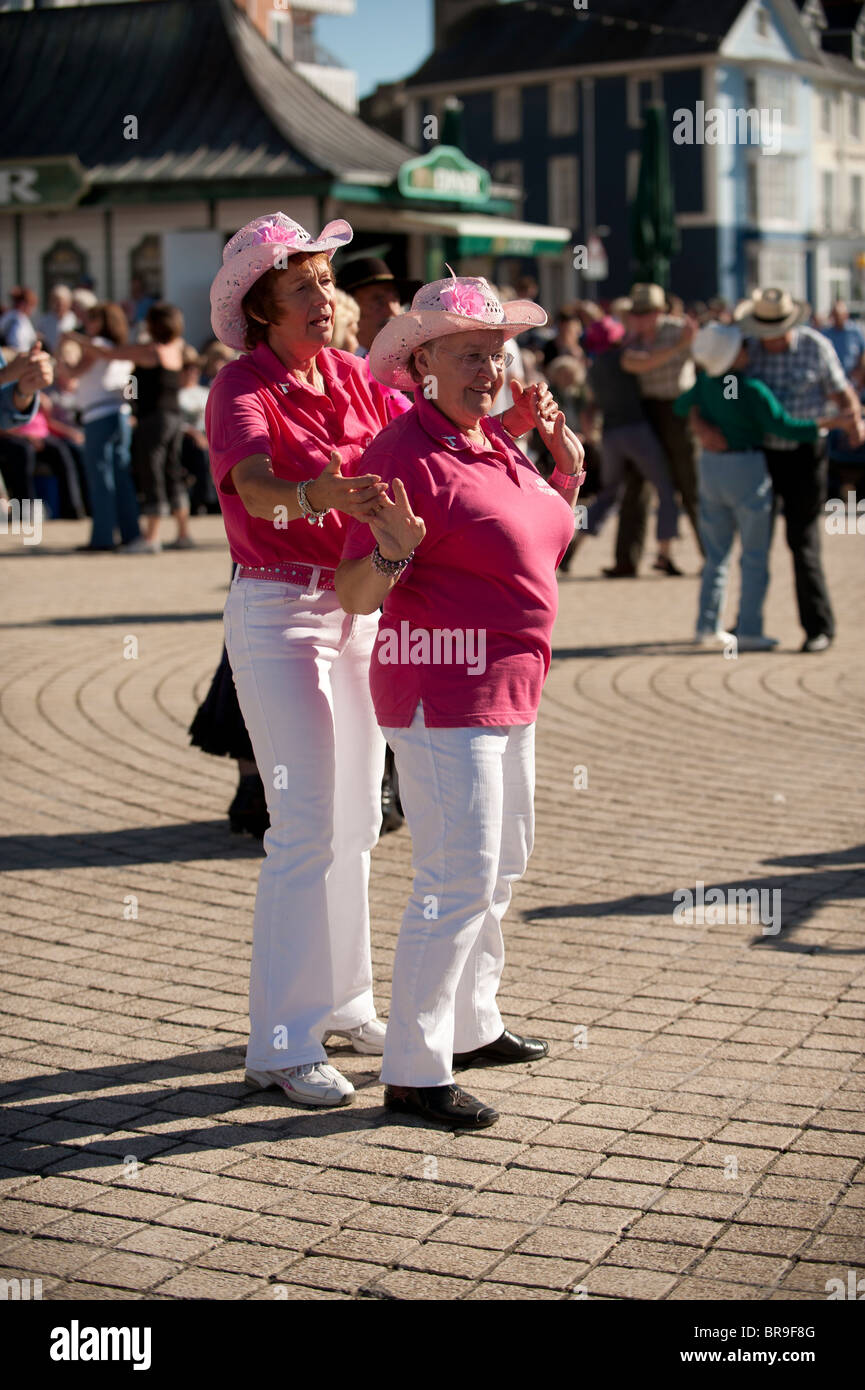 Two women Line Dancing for charity on aberystwyth promenade, August ...