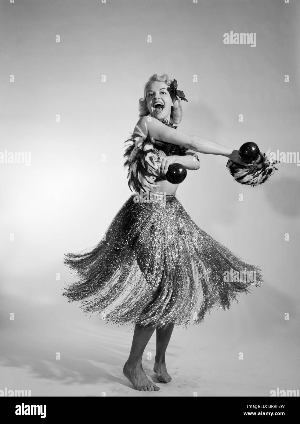1950s 1960s BAREFOOT LAUGHING BLONDE WOMAN DANCING WEARING GRASS HULA ...