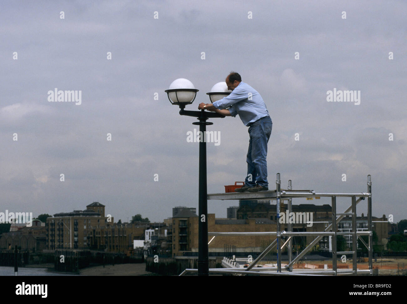 Electrician repairing lamp post - London - UK Stock Photo - Alamy