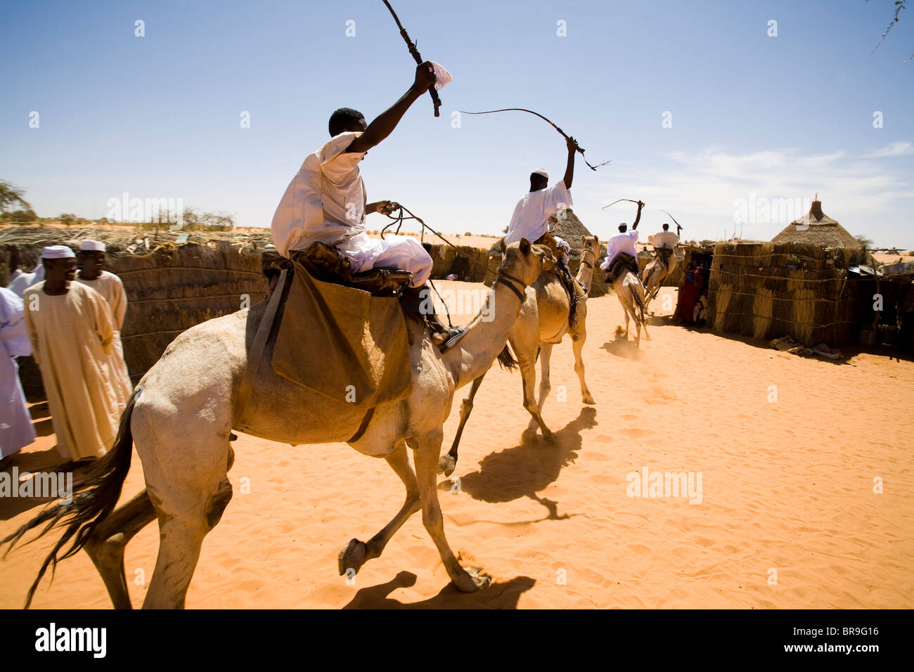 Young men of Darhammid tribe race through the village of Limrat North ...
