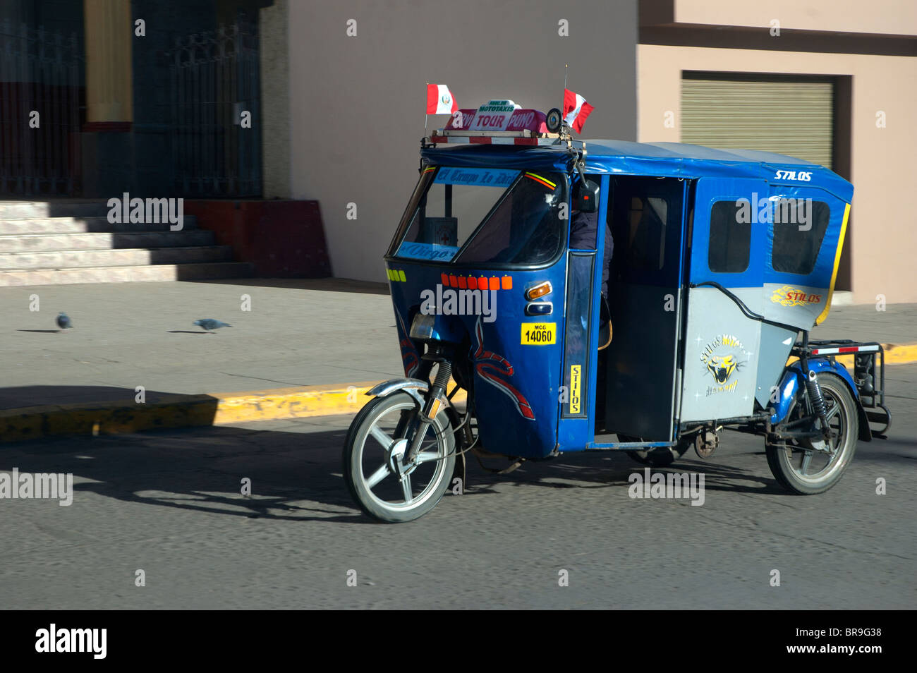 Converted motorcycle type of taxi, public transport, on the street at ...