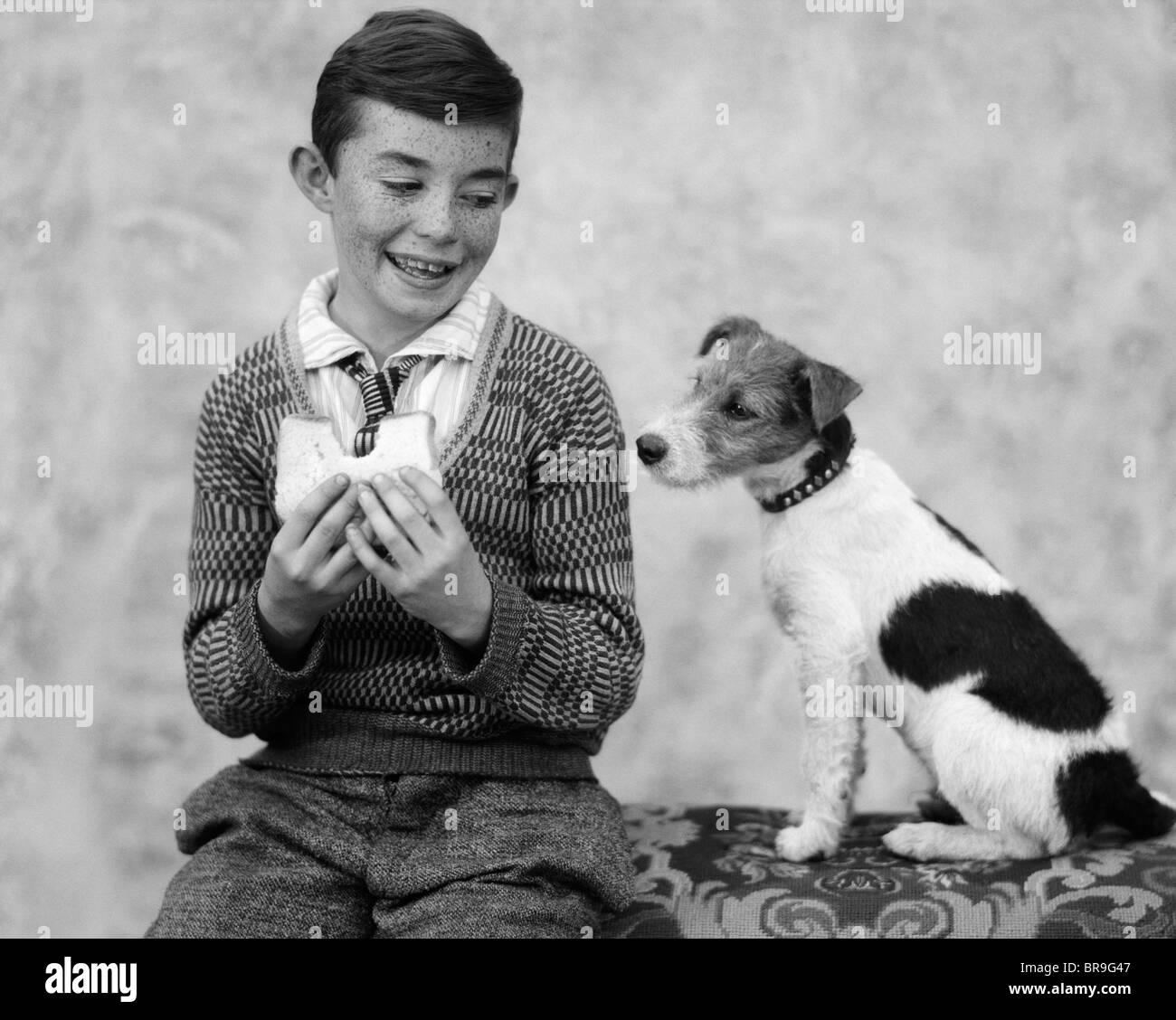 Boy eating sandwich Black and White Stock Photos & Images - Alamy