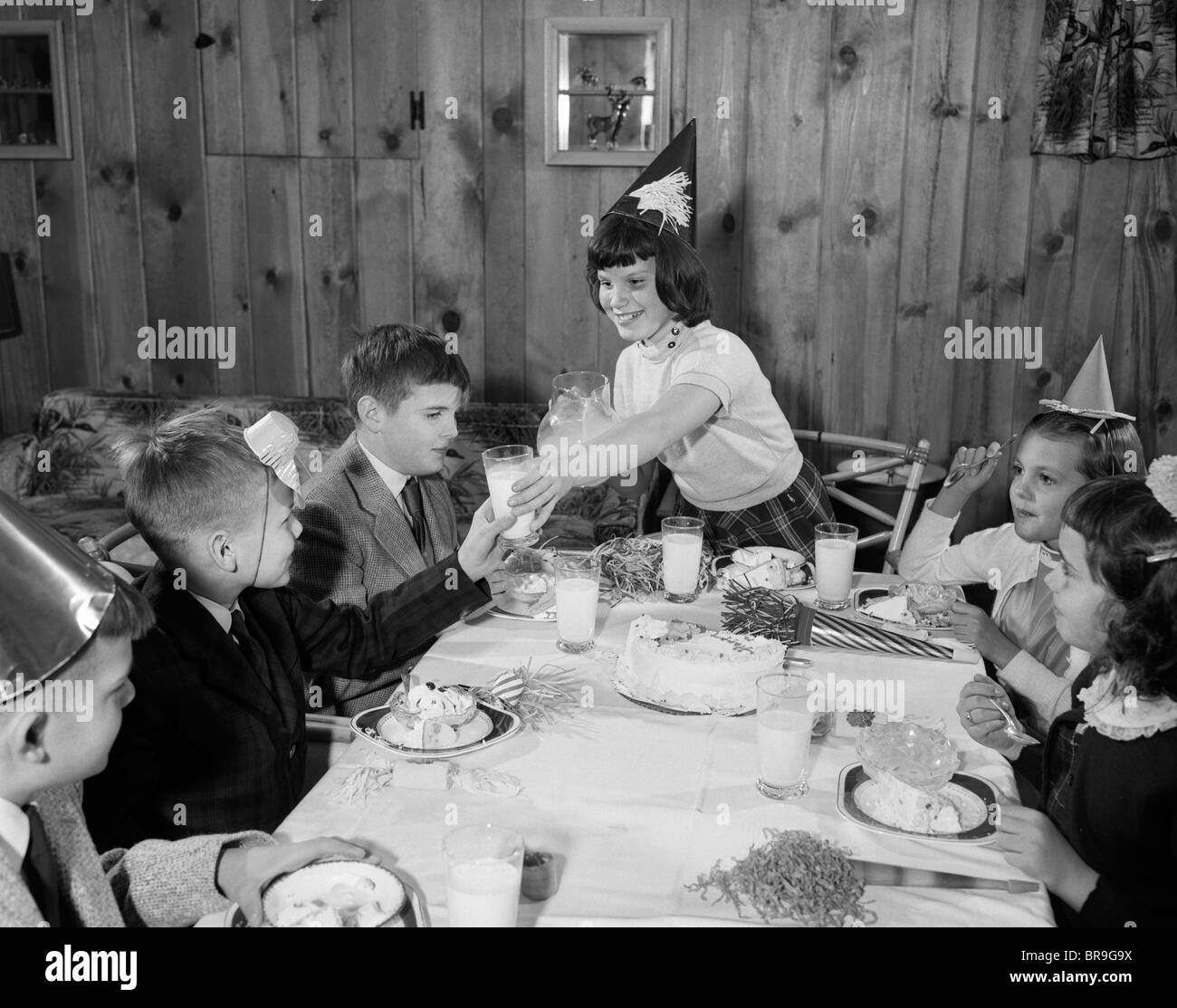 Eating birthday cake Black and White Stock Photos & Images - Alamy