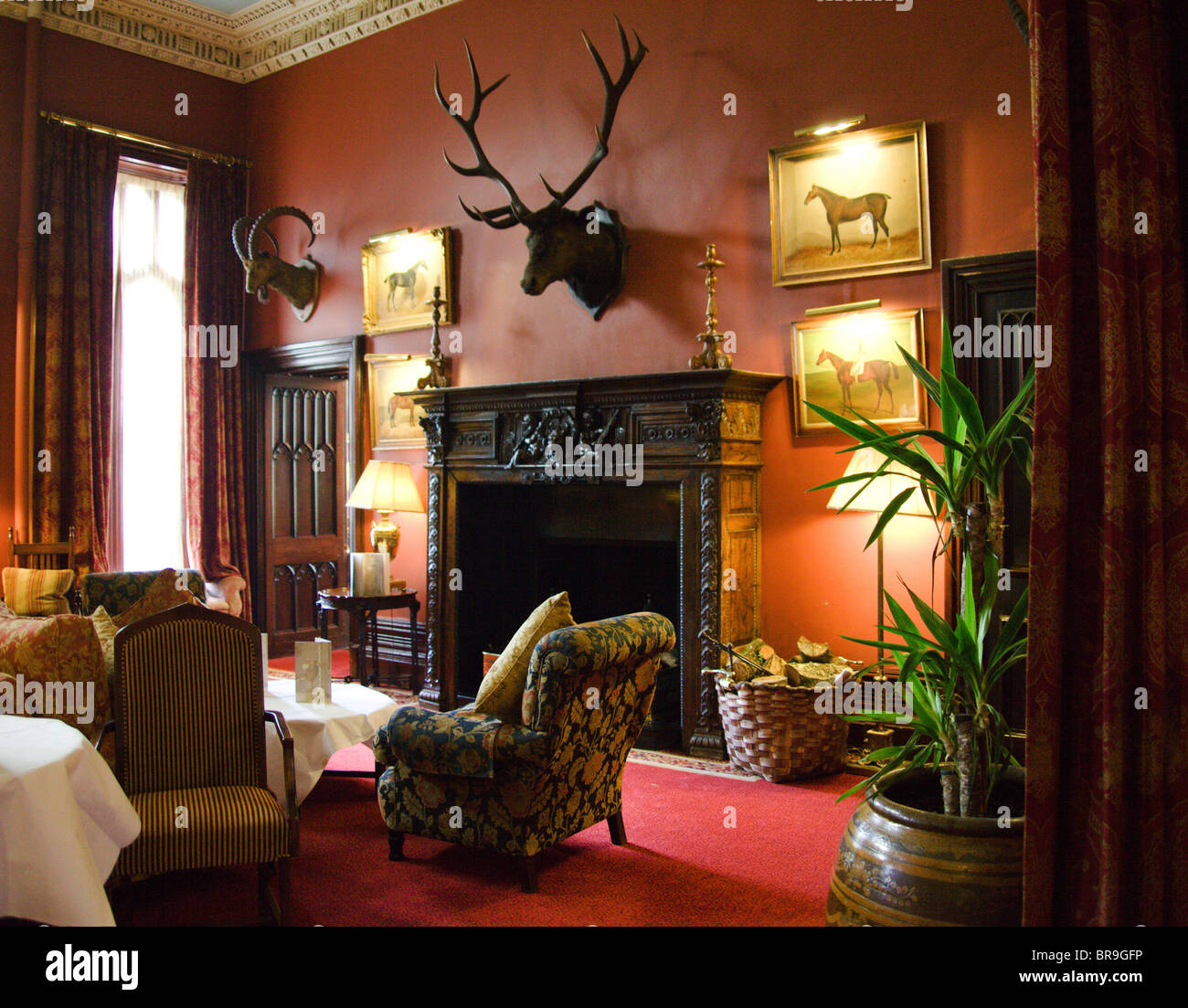 Ireland, the Dromoland Castle the Main Gallery. A red room with hunting ...