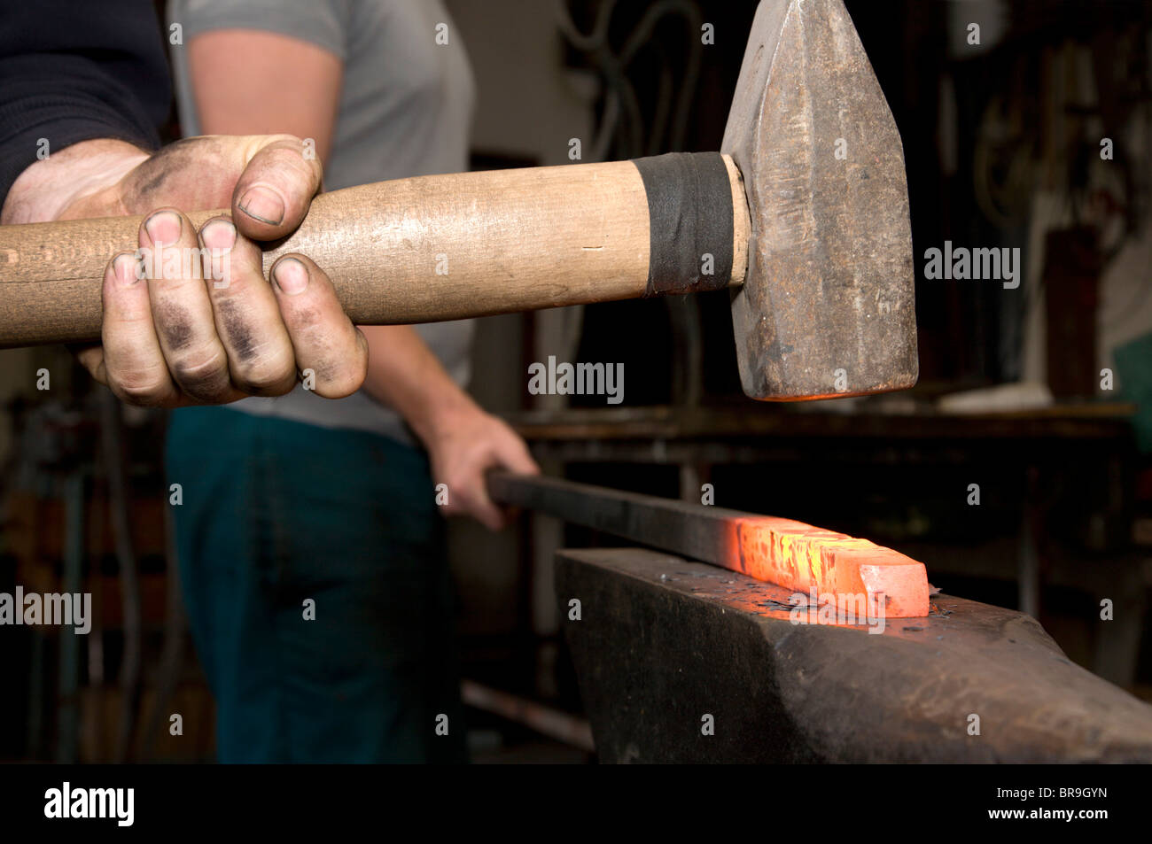 hands of the smith by the work Stock Photo - Alamy